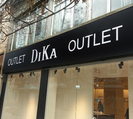 Elegant signboard illuminates the logo of Dika shop | Partners Ltd